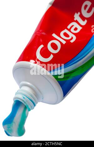 A tube of squeezed colgate toothpaste on a blue background Stock Photo ...
