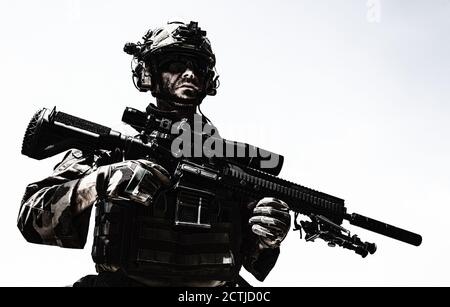 The portrait of marksman on the sky background Stock Photo - Alamy