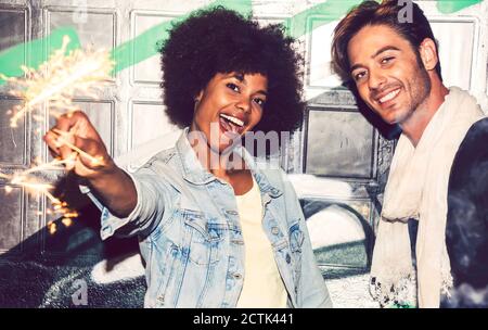 Cheerful man with sparkler looking at camera on blue background Stock ...