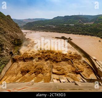 Aerial view of Sanmenxia Dam discharging water due to the flood peak at ...