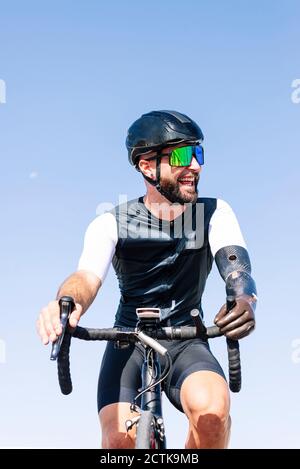 A disabled amputee cyclist riding bicycle with prosthetic leg Stock ...