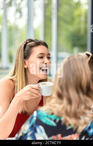Portrait Of Two Female Friends Meeting In Urban Skate Park Stock Photo ...
