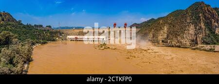 Aerial view of Sanmenxia Dam discharging water due to the flood peak at ...
