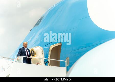 President Donald Trump boards Air Force One for a trip to Detroit ...