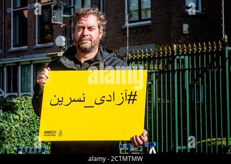 THE HAGUE - Director Dagmar Oudshoorn of Amnesty International rings ...