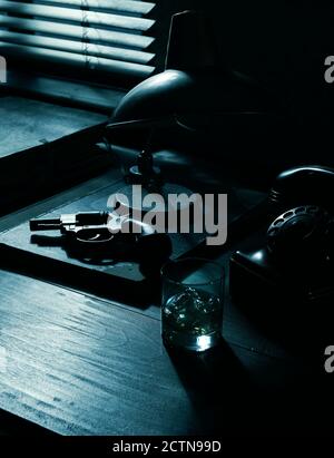 Film noir detective desktop with revolver, whiskey and ashtray ...