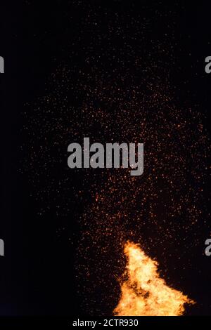 Flaming Embers spreading from Bonfire at Night Stock Photo - Alamy