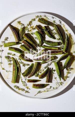 Okra on a plate Stock Photo - Alamy