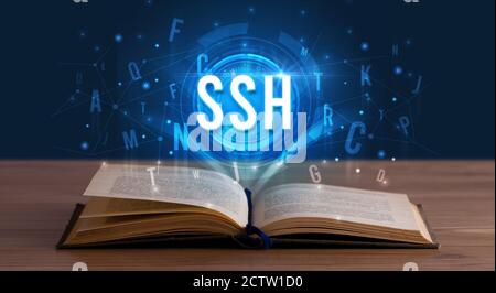 SSH inscription coming out from an open book, digital technology ...