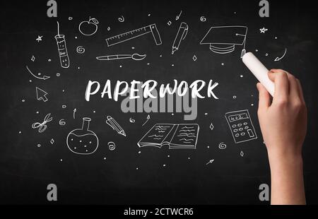 Hand drawing PAPERWORK inscription with white chalk on blackboard ...