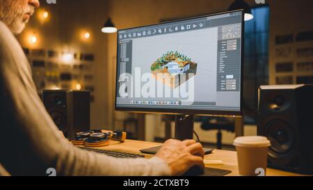 Male Game Developer works on a Level Design on His Personal Computer ...