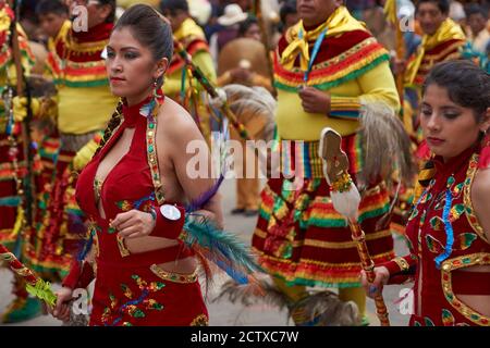 Dancer dressed in ornate Inca style costume parading through the mining ...