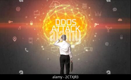 Rear view of a businessman with DDOS ATTACK inscription, online ...