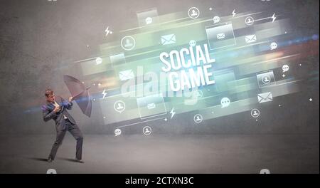 businessman defending with umbrella from social media Stock Photo - Alamy