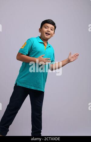 Cute Indian boy in running pose Stock Photo - Alamy