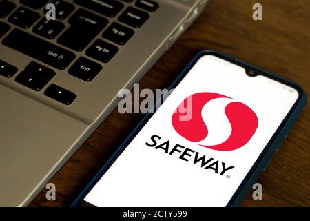 In this photo illustration, the Safeway logo is seen displayed on a ...