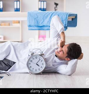 Sleepy doctor tired after long night shift Stock Photo - Alamy