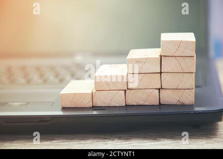 Stacks of Wooden Blocks on Computer Background Stock Photo - Alamy