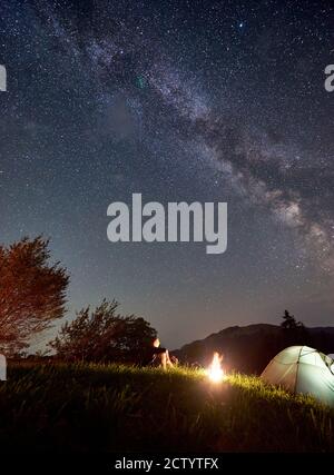 A vertical shot of a landscape under the starry sky at night Stock ...