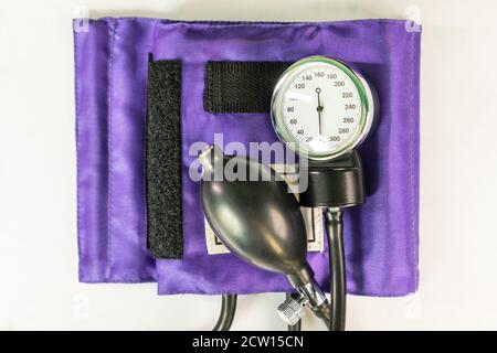 Purple color Sphygmomanometer on the table isolated Stock Photo - Alamy