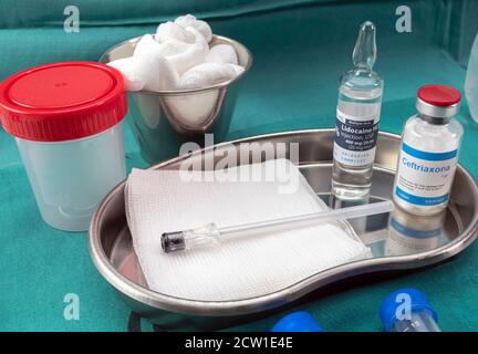 Needle for lumbar puncture together with anesthesia and antibiotic to ...