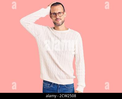 Young handsome man wearing a casual t-shirt over isolated yellow ...