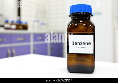 Selective focus of benzene liquid chemical compound in dark glass ...
