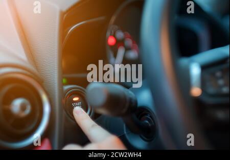 Woman Pushing An Engine Start Button, Ignition Switch Stock Photo - Alamy