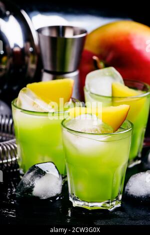 Alcoholic cocktail Aztec, with gold tequila, blue curacao liqueur ...