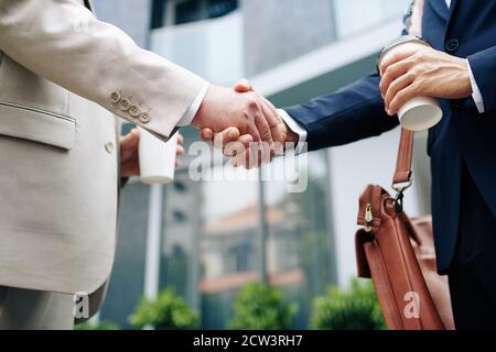 Asian Business people greeting each other in a hotel Stock Photo - Alamy
