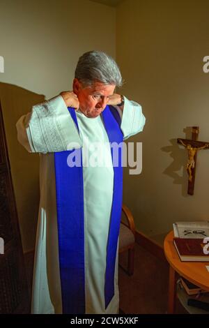 Wearing ceremonial vestments, the monsignor of a Southern California ...