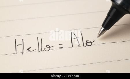 Beginner Romanian language learner writing Hello word Buna ziua for ...