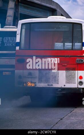 Exhaust smoke and fumes from bus in traffic on road in Manila ...
