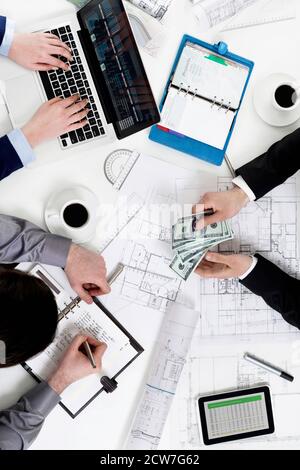 Discussing financial paper Stock Photo - Alamy