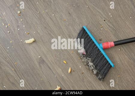 Food scattered on the floor with a dustpan and brush nearby Stock Photo ...