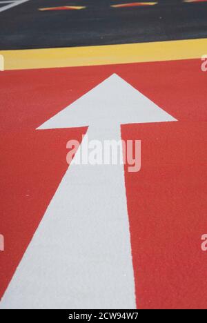 Direction arrow points in one way Stock Photo - Alamy