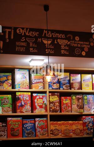 Types of Cereals on display in a coffee shop, milk and cereal shop ...