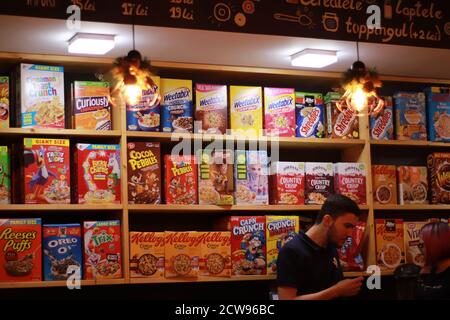 Types of Cereals on display in a coffee shop, milk and cereal shop ...