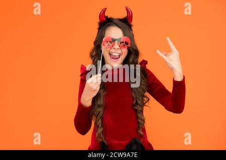 Happy girl on Halloween wear funny carnival costume and glasses indoor ...