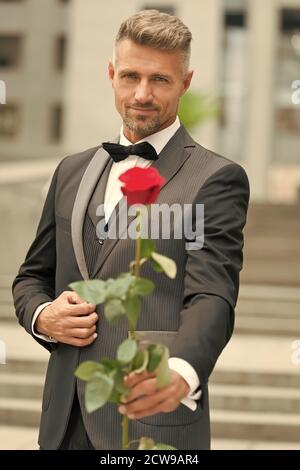 Happy Valentine's Day darling. Black pretty woman closing man eyes with ...