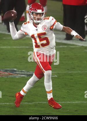 Kansas City Chiefs QB Patrick Mahomes (15) throws a pass while falling ...