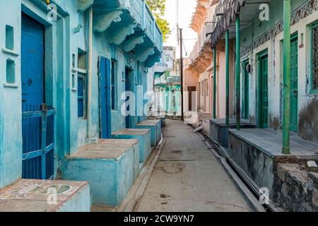 Narrow colourful backstreets of the village of Delwara in rural ...