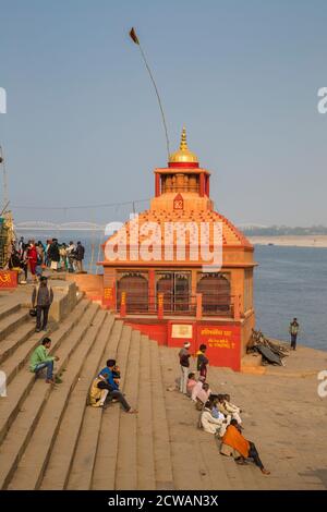 India, Uttar Pradesh, Varanasi, Scindia Ghat, Shiva temple sinking into ...