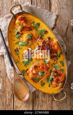 Kenyan chicken in coconut curry sauce Kuku Paka Recipe closeup on the ...