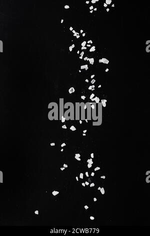 Pile of salt crystals isolated over the white background. Top view ...