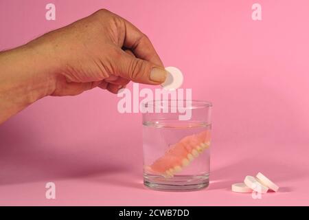 cleaning false teeth Stock Photo - Alamy