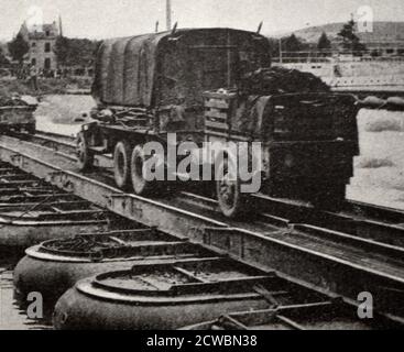 A historical photograph showing the pontoon bridge built by the 50th ...