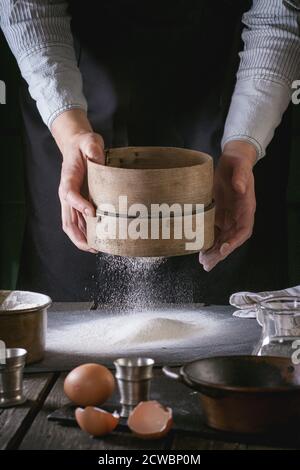 Flour on old wooden table. Top view Stock Photo - Alamy