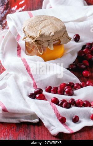 Red towel over wooden kitchen table. View from above with copy space ...