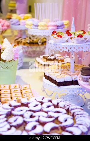 Table with loads of cakes, cupcakes, cookies and cakepops Stock Photo ...